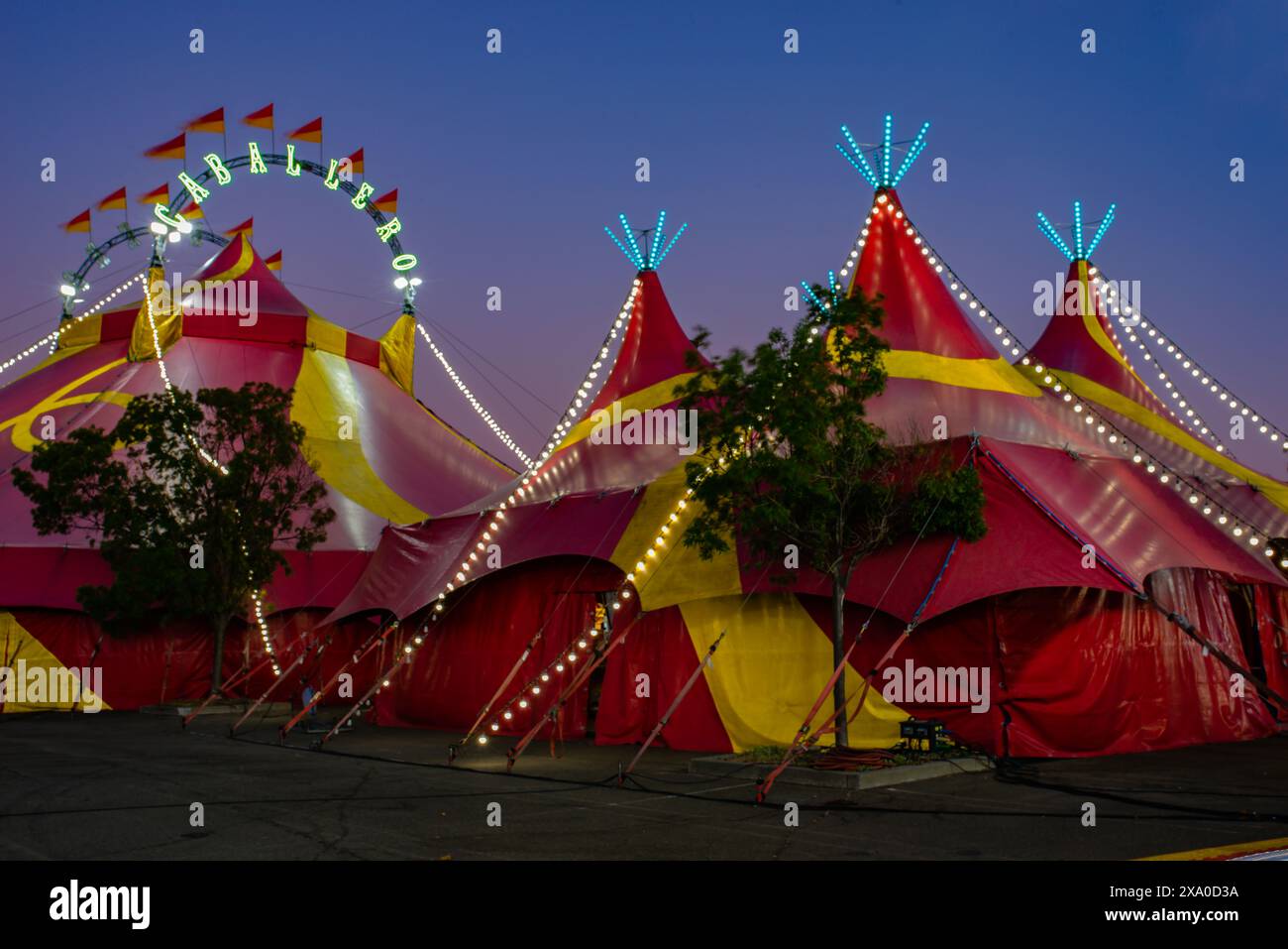 The Big top with colorful lights illuminate tents at night Stock Photo ...