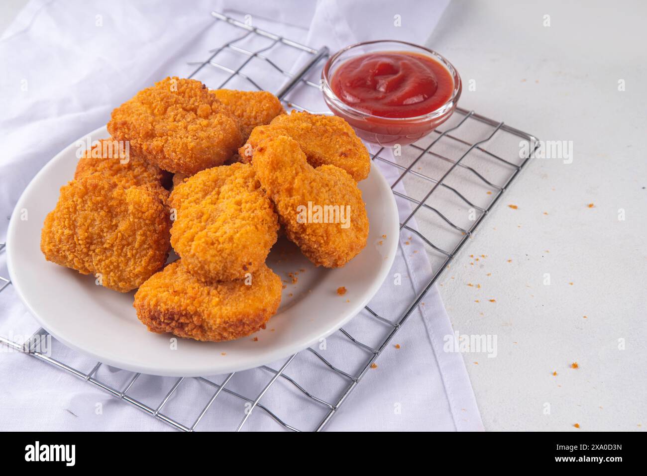 Traditional golden fresh fried chicken nuggets on a plate, with ketchup ...