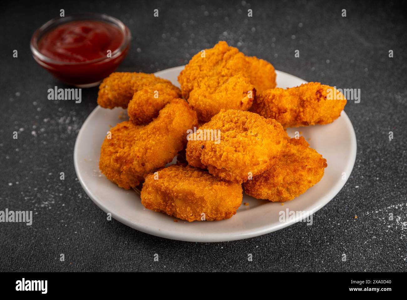 Traditional golden fresh fried chicken nuggets on a plate, with ketchup ...