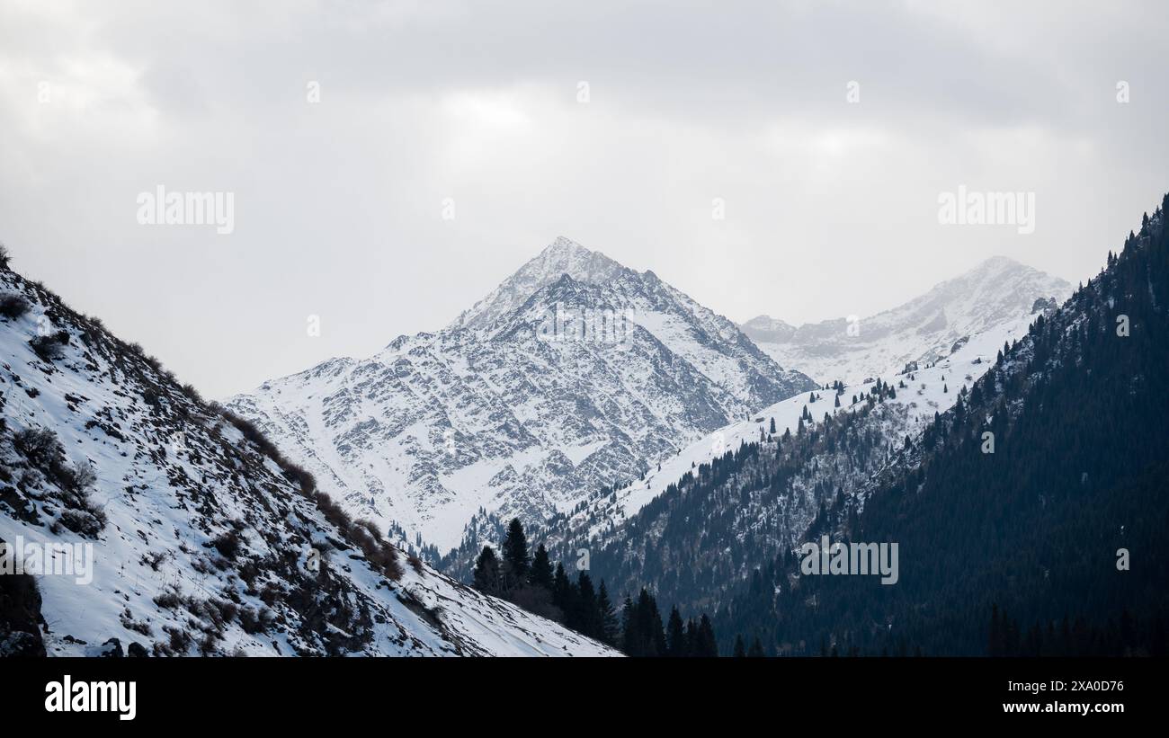 A scenic view of Xinjiang snow-capped mountains Stock Photo - Alamy