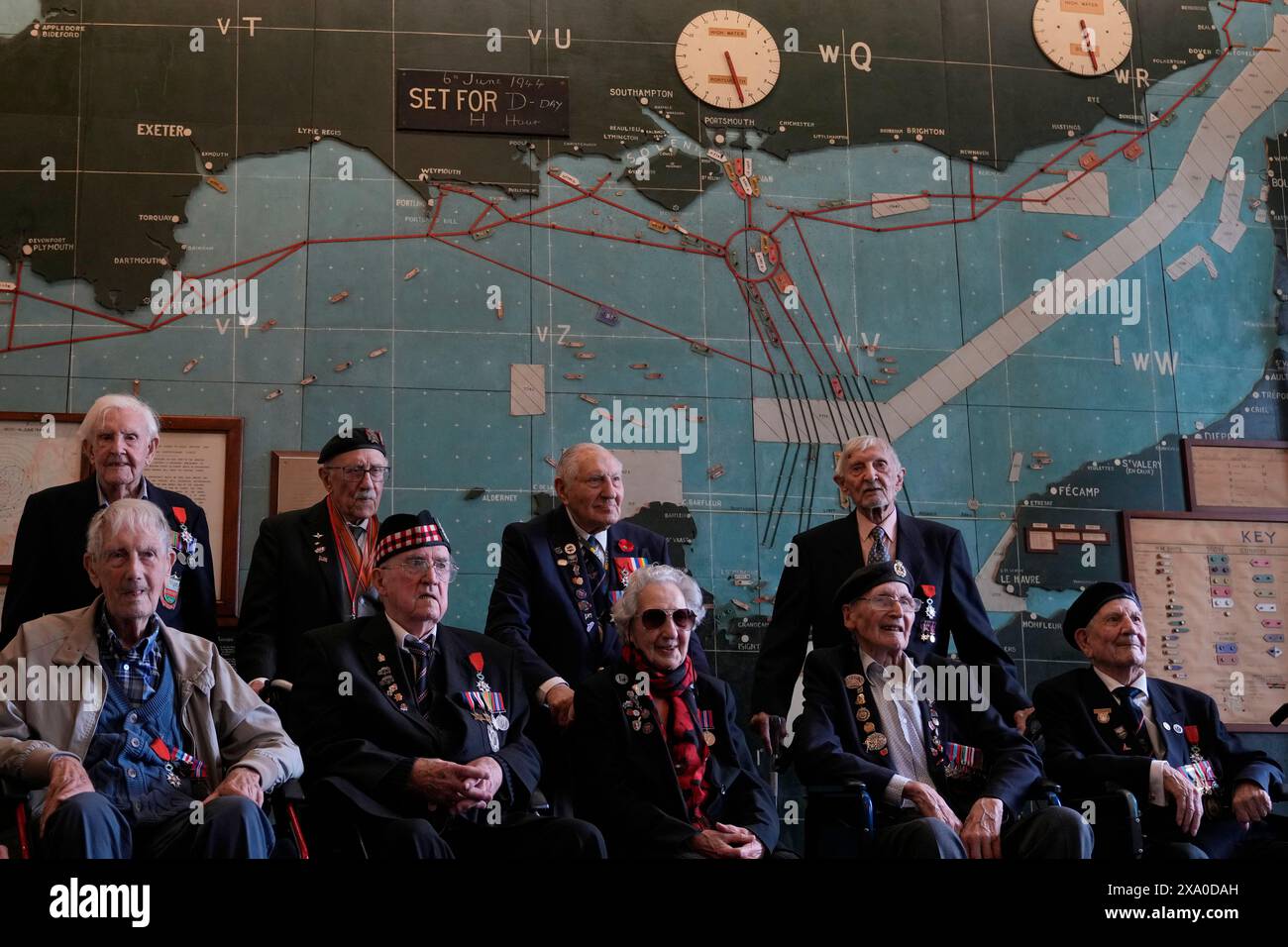 Normandy campaign veterans pose in the 'Map Room' which shows the large ...