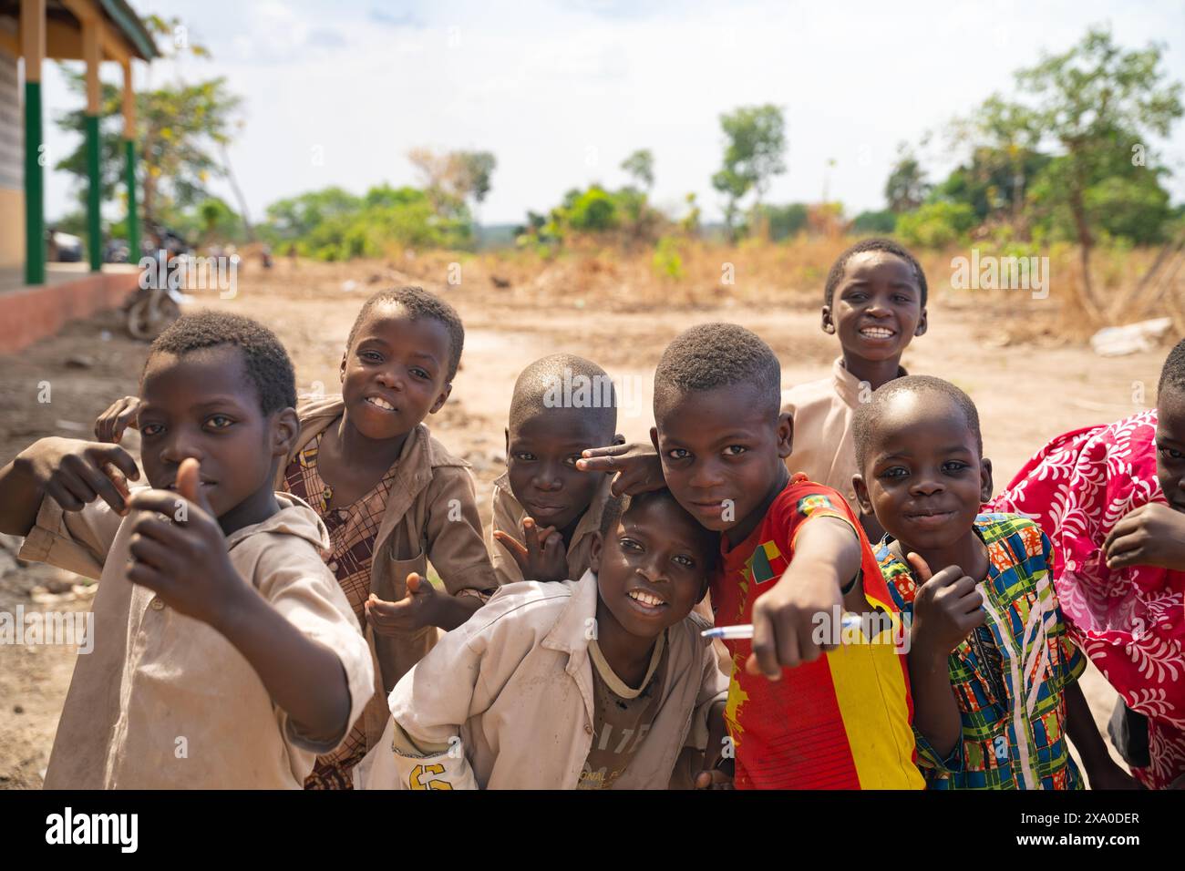A group of happy African primary school children at a ceremonial ...