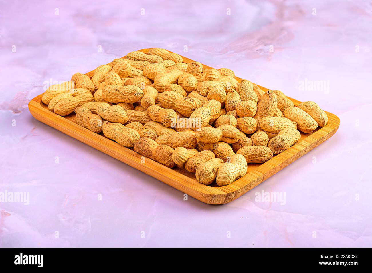 A wooden Tray Overflowing with Peanuts Stock Photo - Alamy