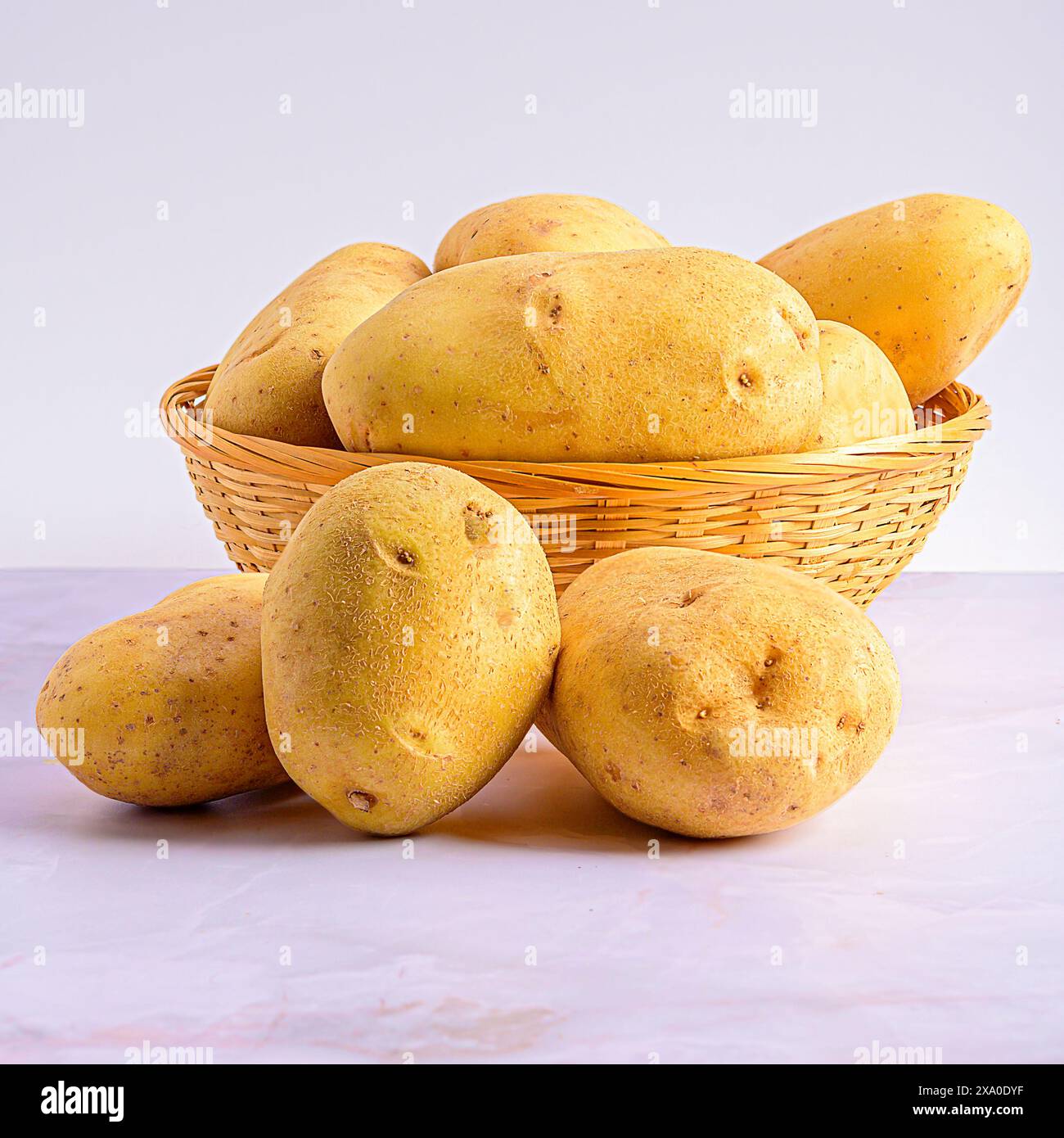 A Wicker Basket Overflowing with Potatoes Stock Photo - Alamy