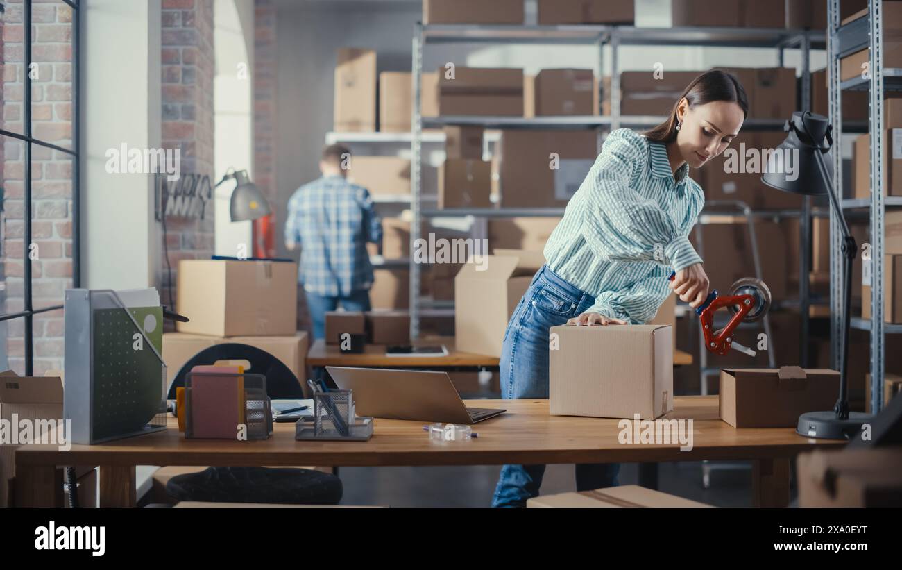 Beautiful Storeroom Worker Preparing a Small Parcel for Postage ...