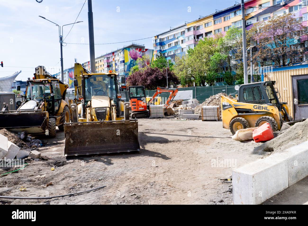 The bulldozers by concrete barriers at Bucharest construction site, Romania Stock Photo - Alamy