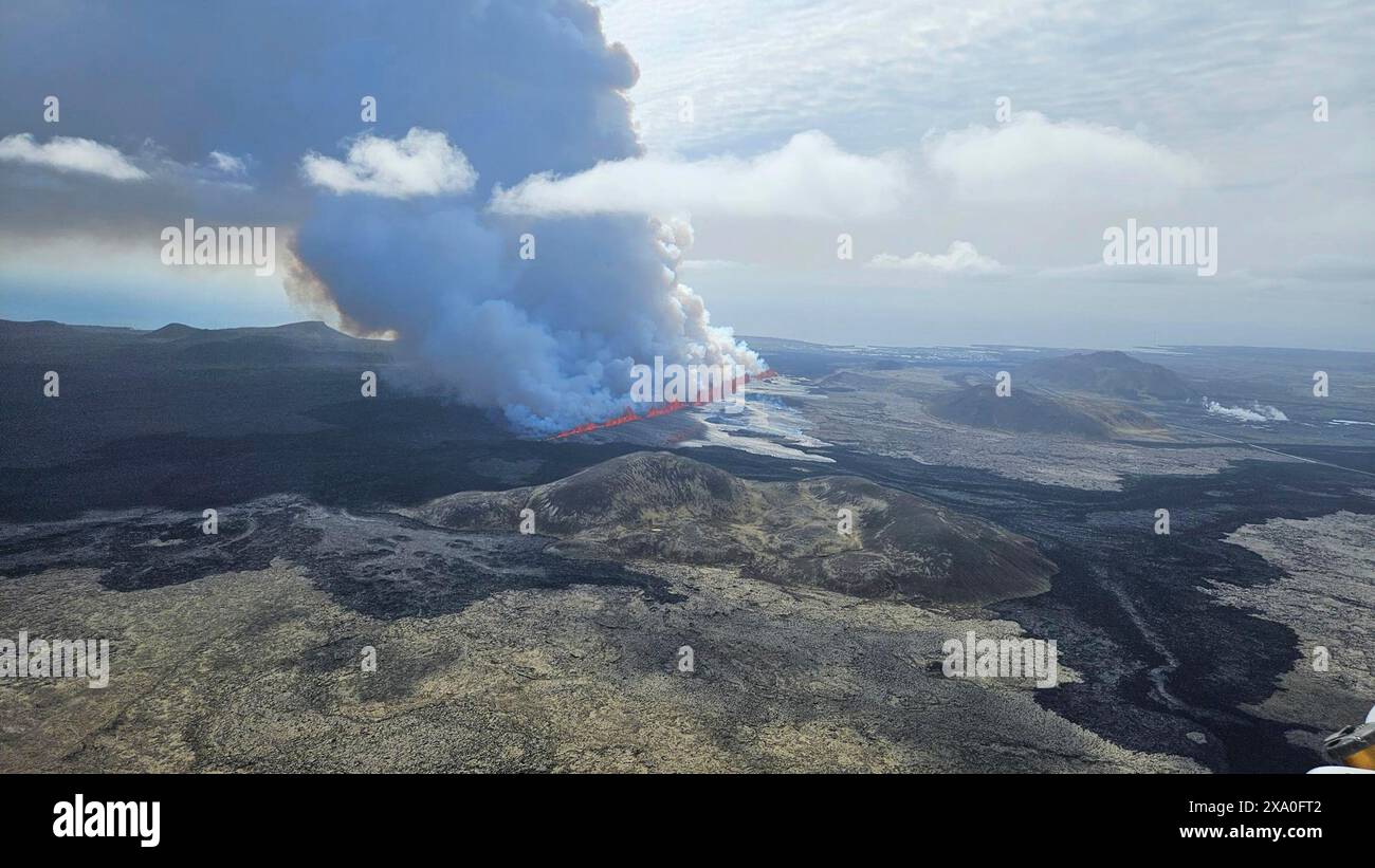 Grindavik, Iceland. 29 May, 2024. Aerial view showing a long curtain of lava and gas spewing ...