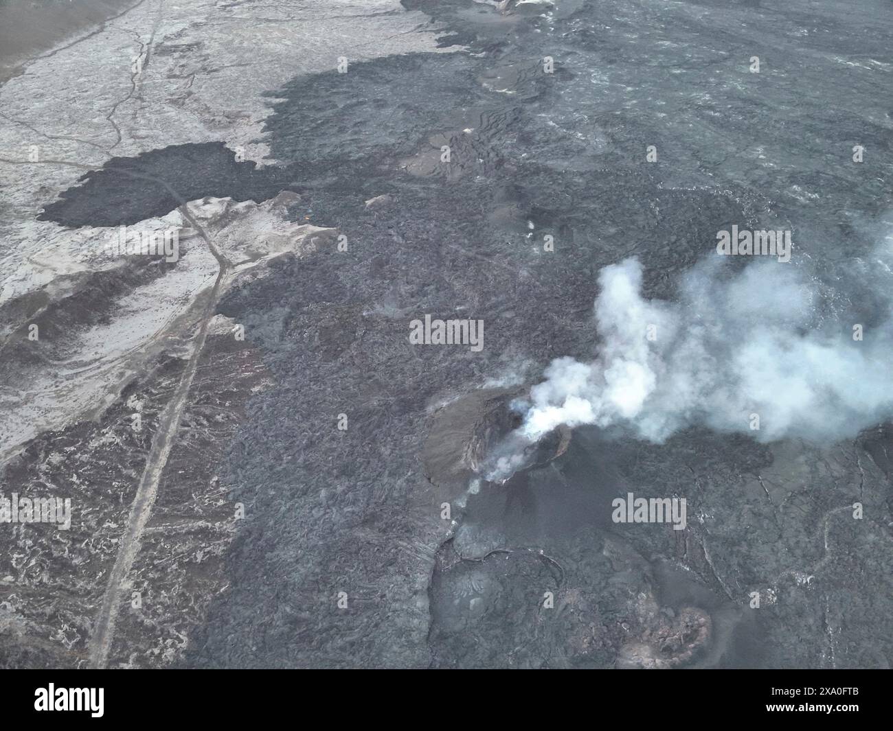 Grindavik, Iceland. 08 May, 2024. Aerial view showing hardened magma ...