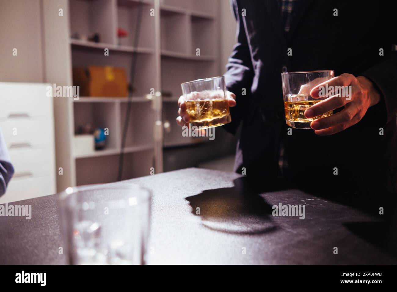 Businessmen and investors drink alcohol together in office after ...