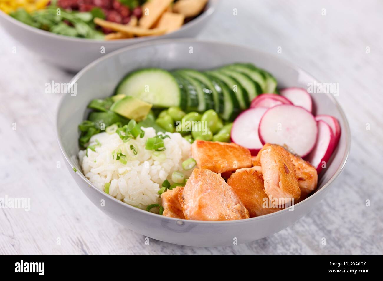 Two assorted bowls of food on tablef Stock Photo - Alamy