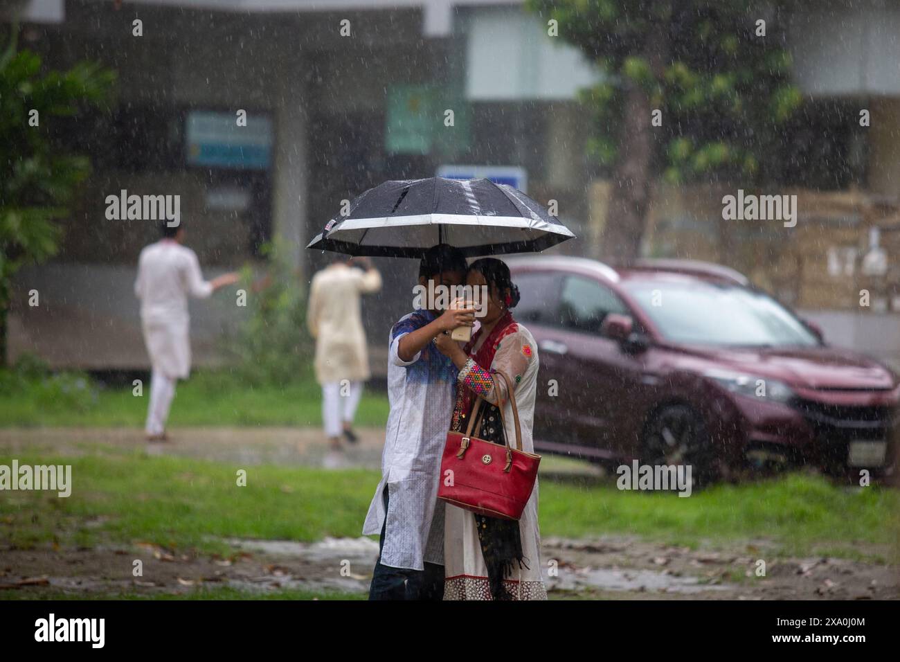 A mother and son enjoying rain in Dhaka, Bangladesh Stock Photo - Alamy