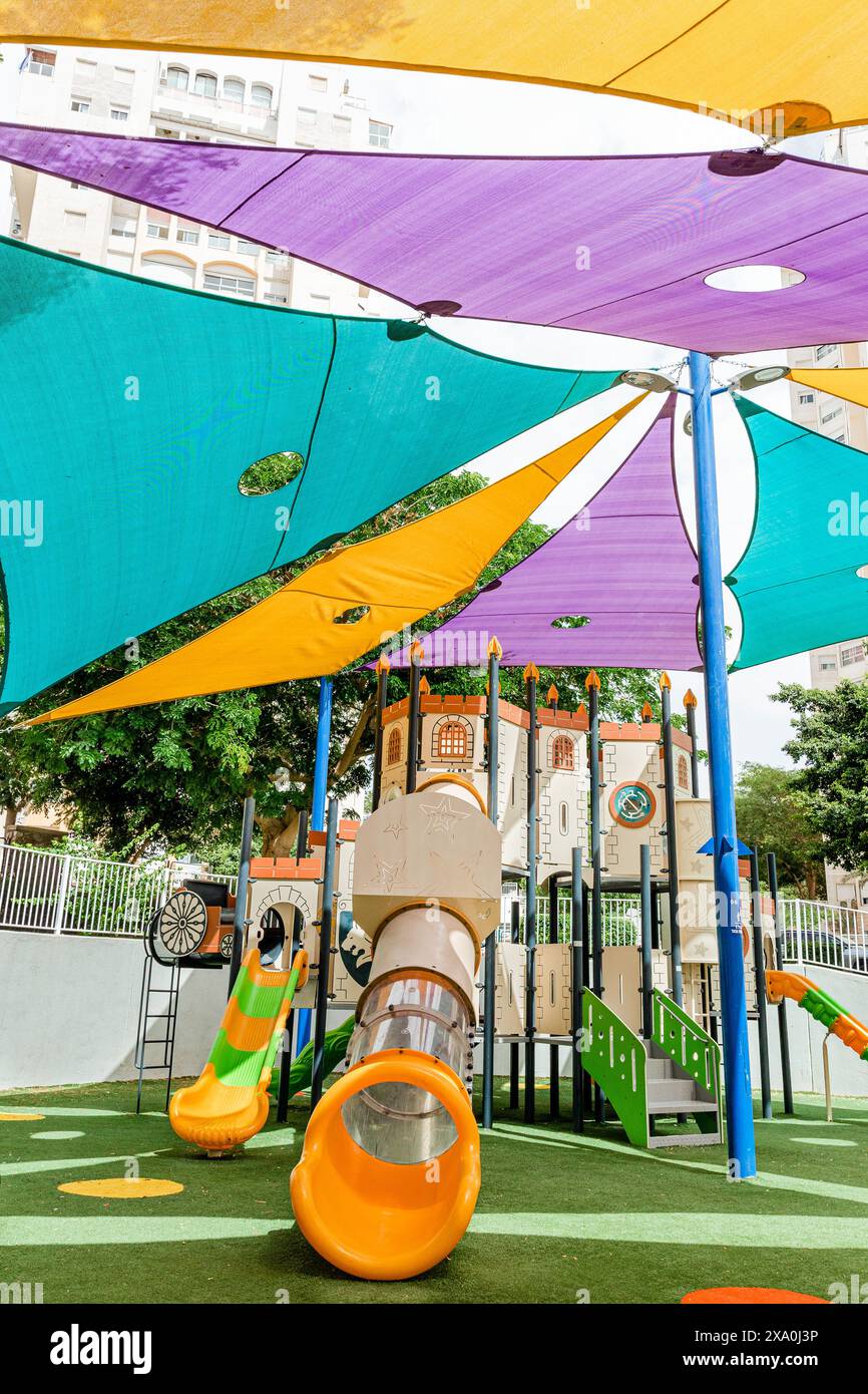 Modern colorful children's playground with canopy. Children's castle ...