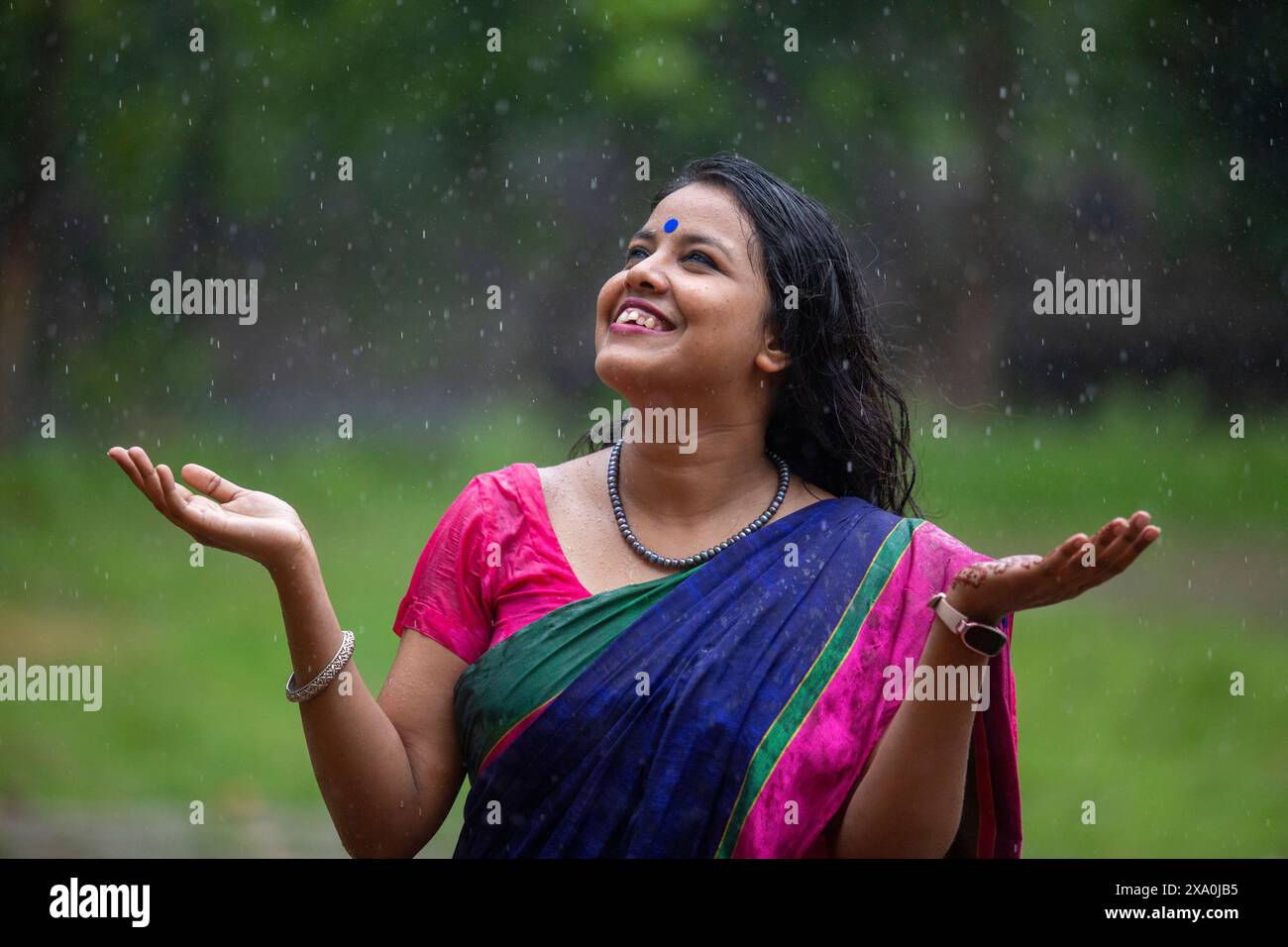 A women enjoying rain in Dhaka, Bangladesh Stock Photo - Alamy