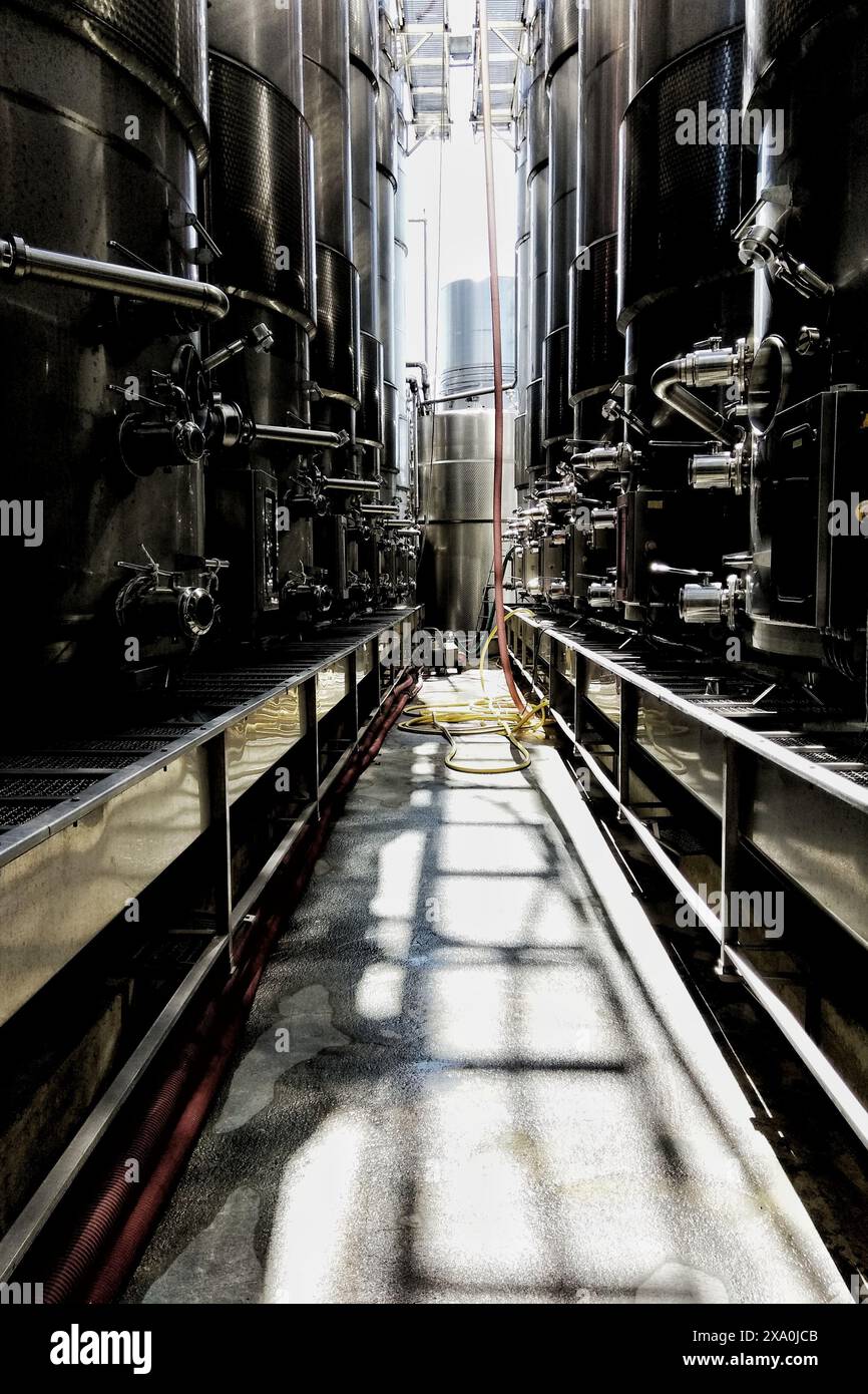 The metal tanks and machinery fill the factory in a long row Stock ...