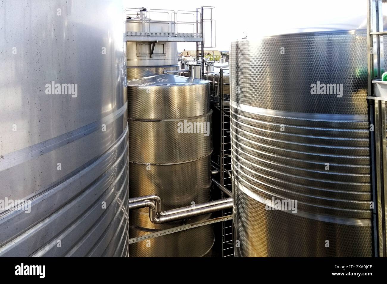 The tall cylindrical tanks at an industrial site Stock Photo - Alamy