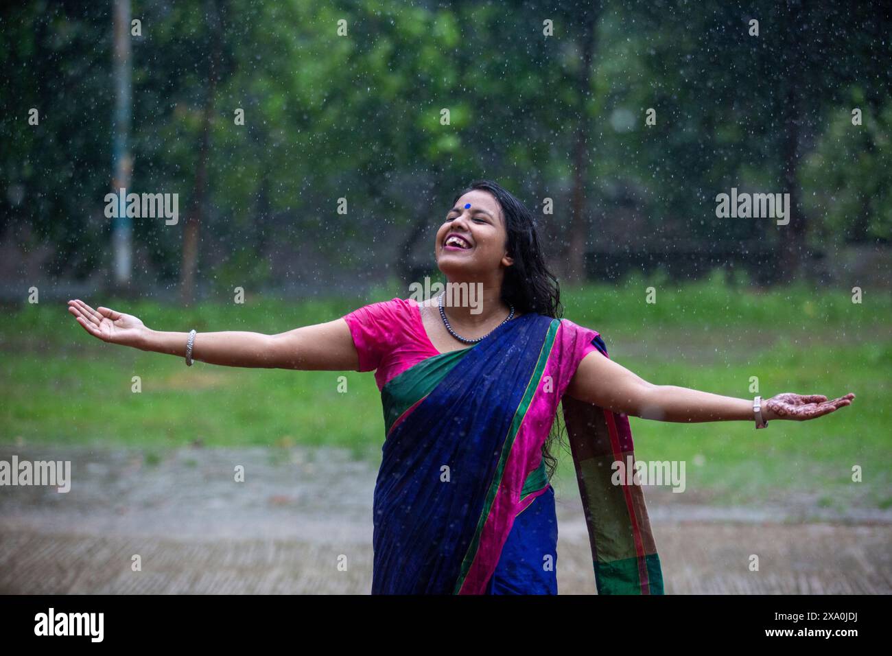 A women enjoying rain in Dhaka, Bangladesh Stock Photo - Alamy