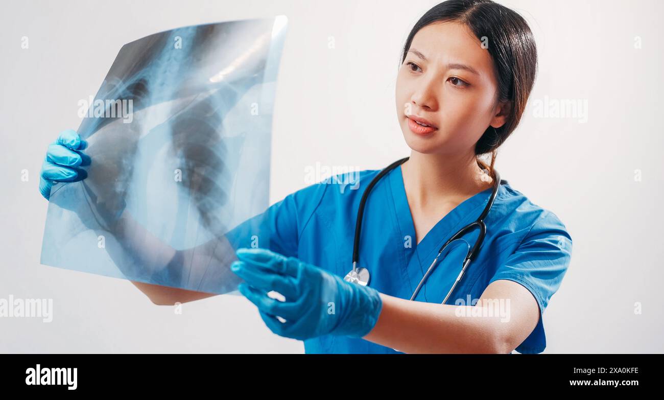 Medical diagnostics. Chest x-ray. Woman doctor studying lungs ...