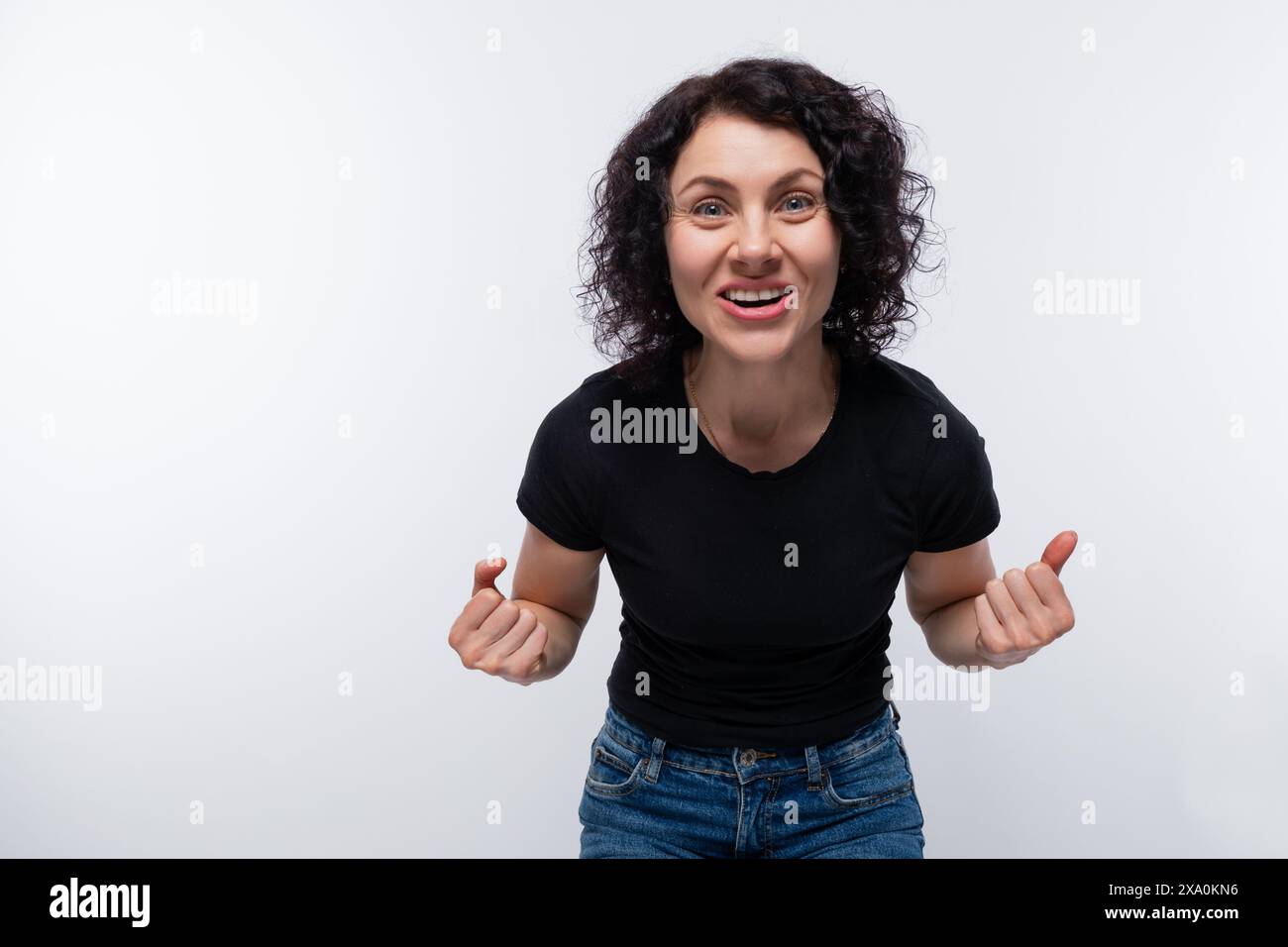Portrait of a pretty woman with a perm wearing a basic t-shirt Stock ...