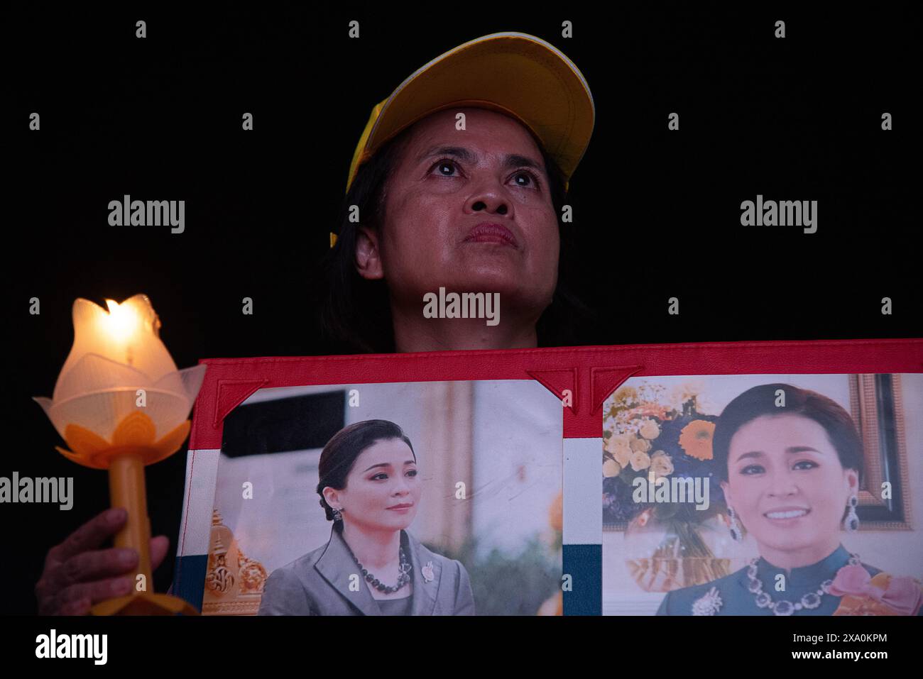 Bangkok, Thailand. 03rd June, 2024. A Thai royalist supporter holds the portraits of Thai Queen ...