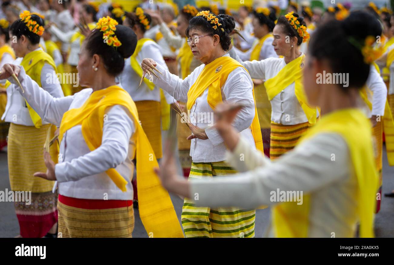 Thai performers wearing traditional costumes perform Thai Lanna dance ...