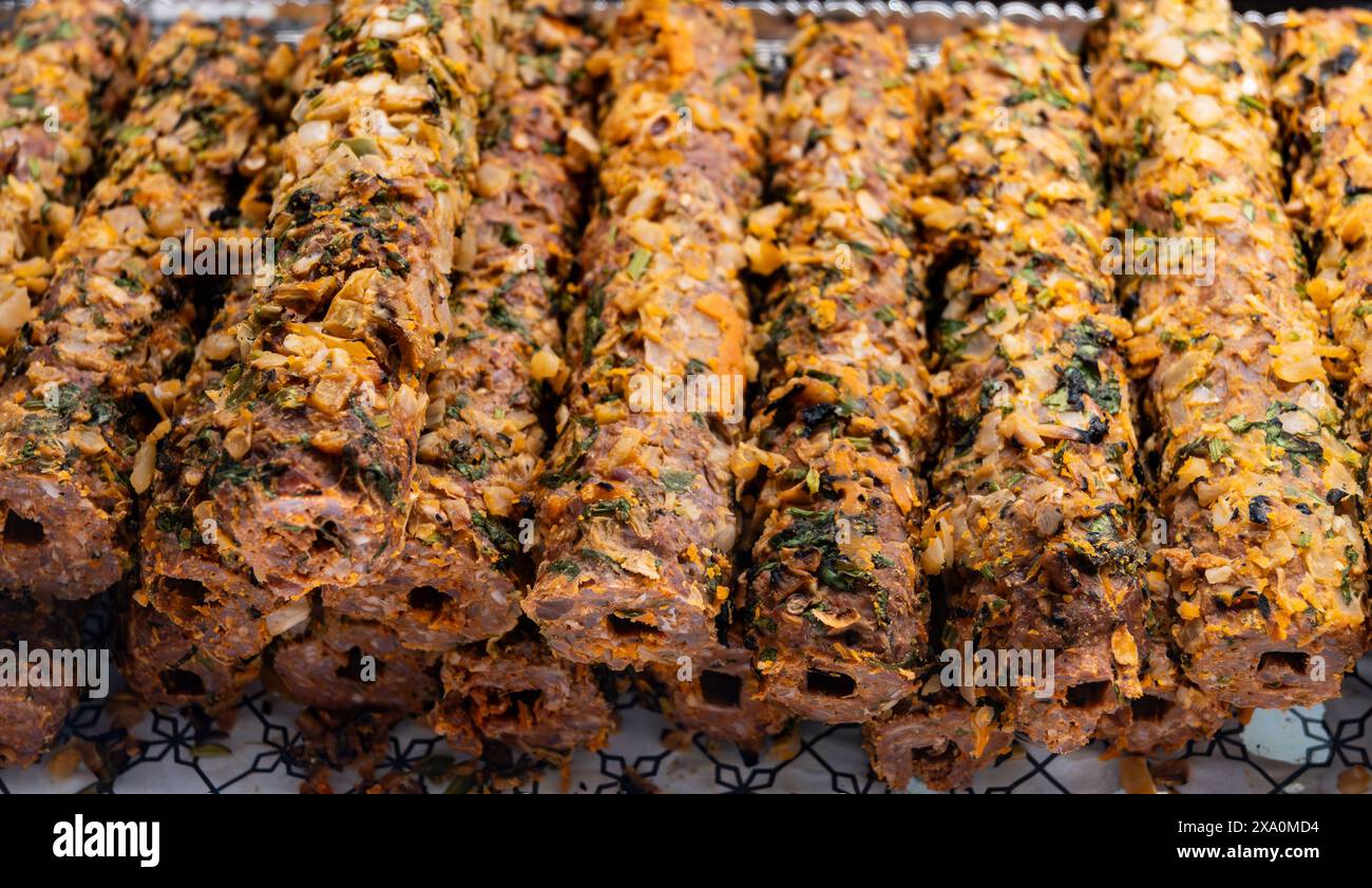 Lamb seekh kebabs meat food ready to cook on charcoal grill on display ...