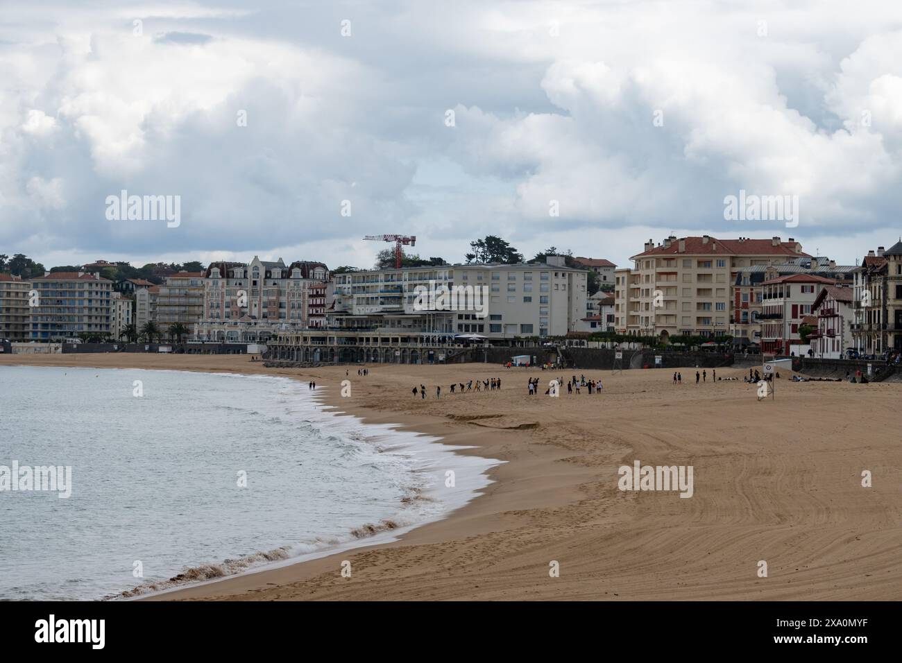 Houses and large beach in Saint-Jean-de-Luz fishing port on Basque coast, famous resort, known ...