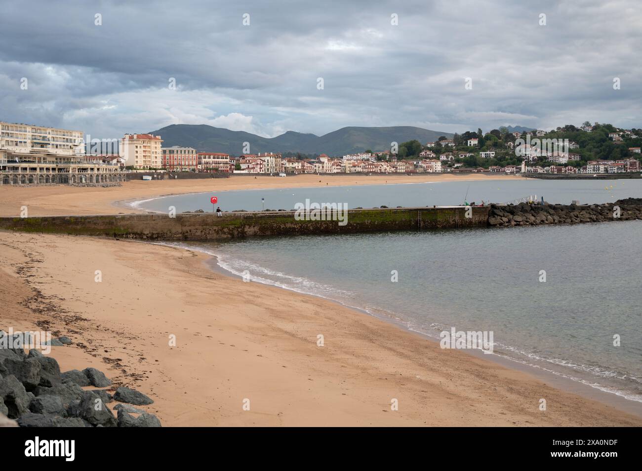 Sandy beach and houses of Saint Jean de Luz town on Basque coast ...