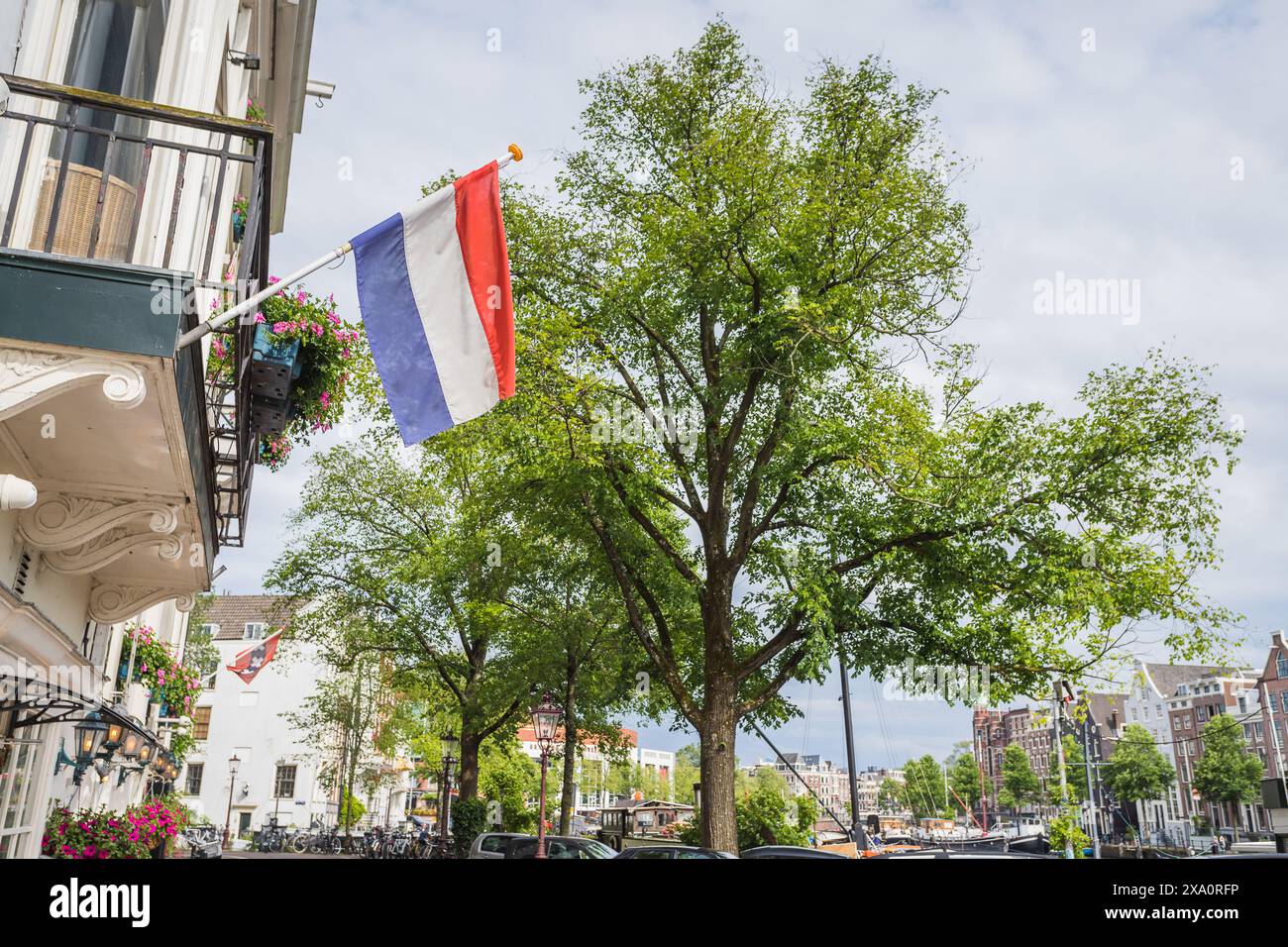 A Dutch flag pictured above a building along the Groenburgwal canal in ...