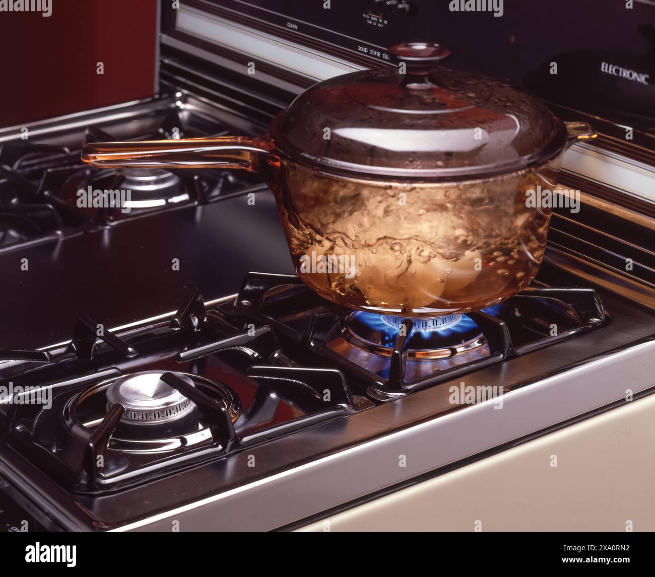 Gas stove top, boiling water Stock Photo - Alamy