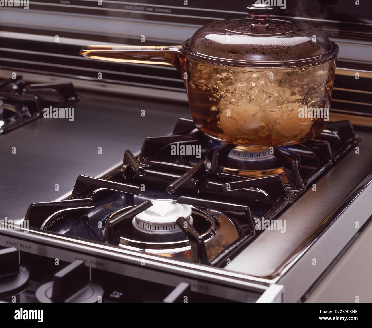 Gas stove top, boiling water Stock Photo - Alamy