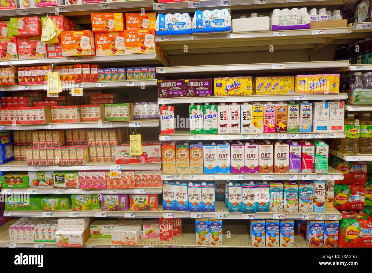 Fruit juice display shelves in supermarket grocery store Stock Photo ...
