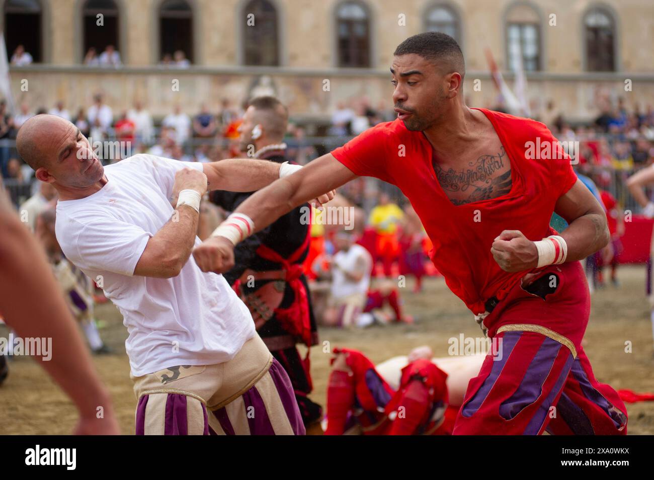 Players clash during the semifinal between Whites (Santo Spirito) and ...