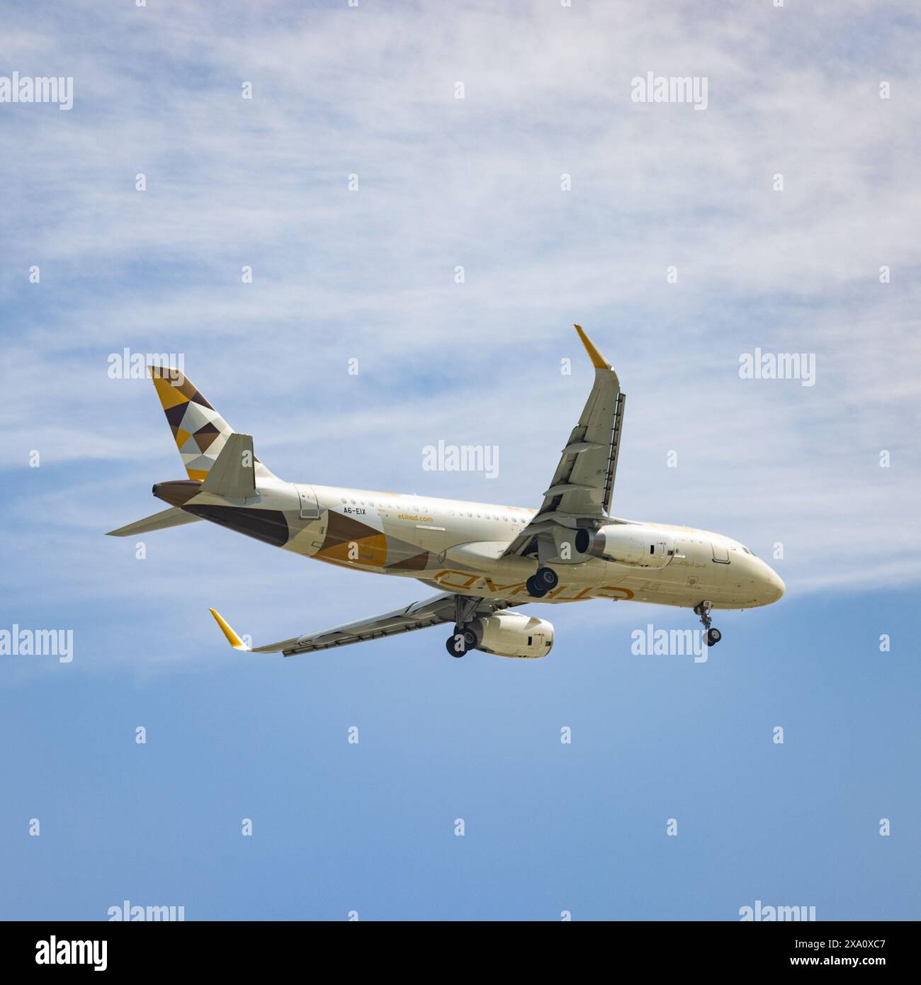 Airplane soaring in clear blue skies above Stock Photo - Alamy