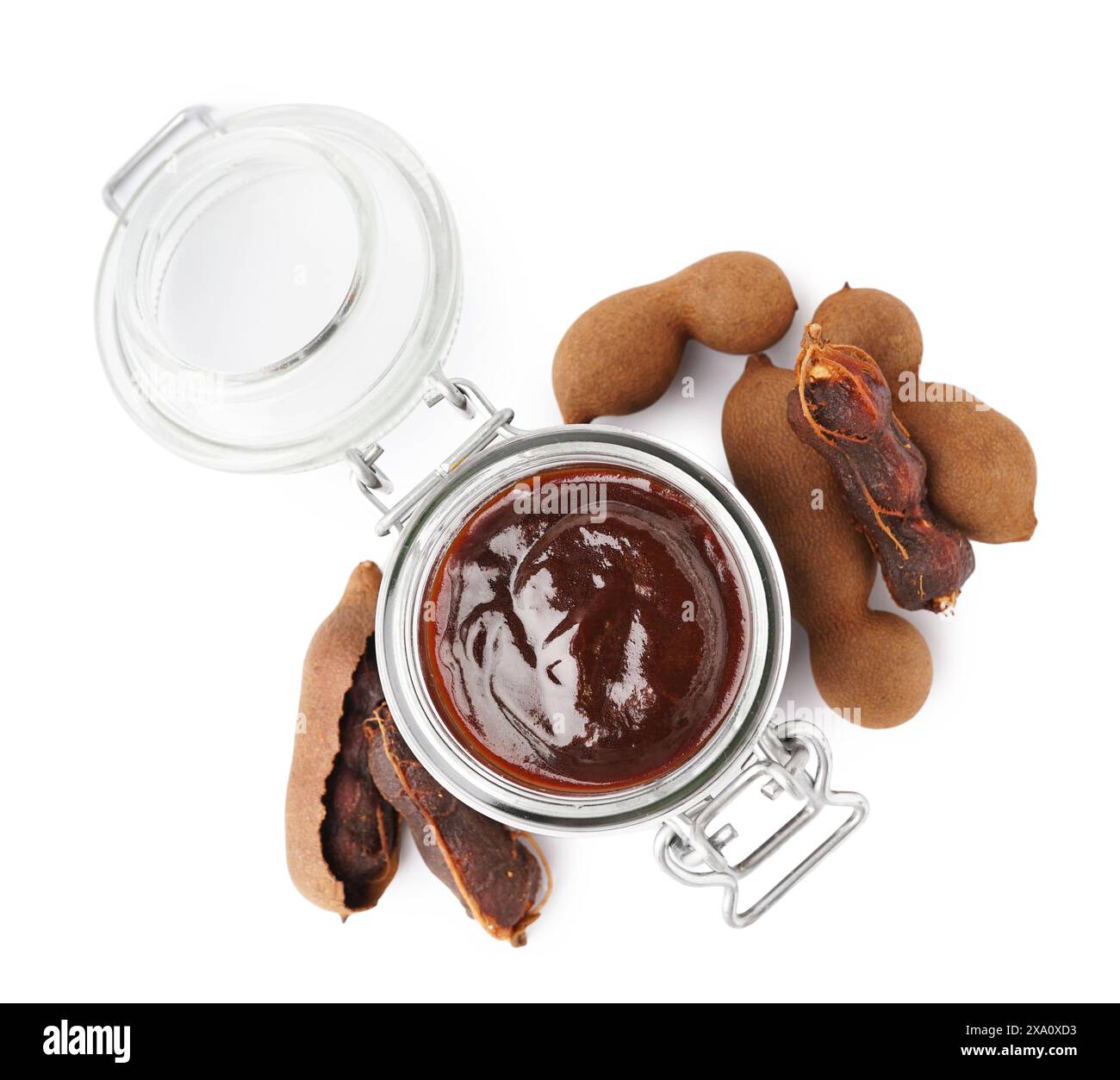 Jar with tasty tamarind jam with fruits on white background Stock Photo ...