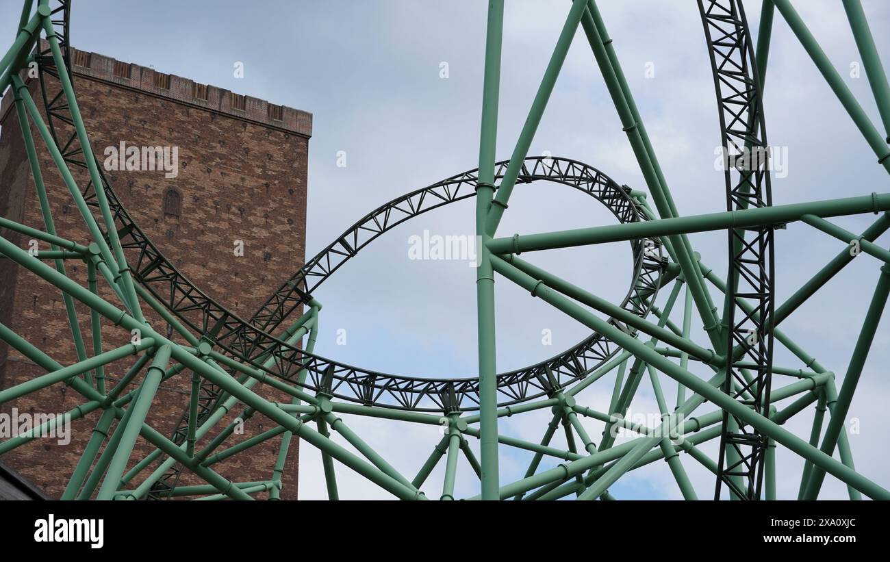 Green-coloured rollercoaster track and huge construction of an extreme ...