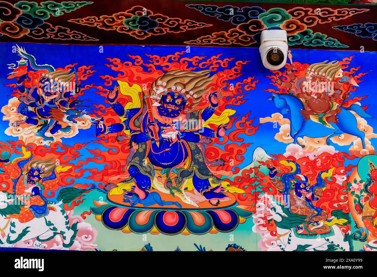 Buddhist temple interior featuring ornate decorations, statues of ...