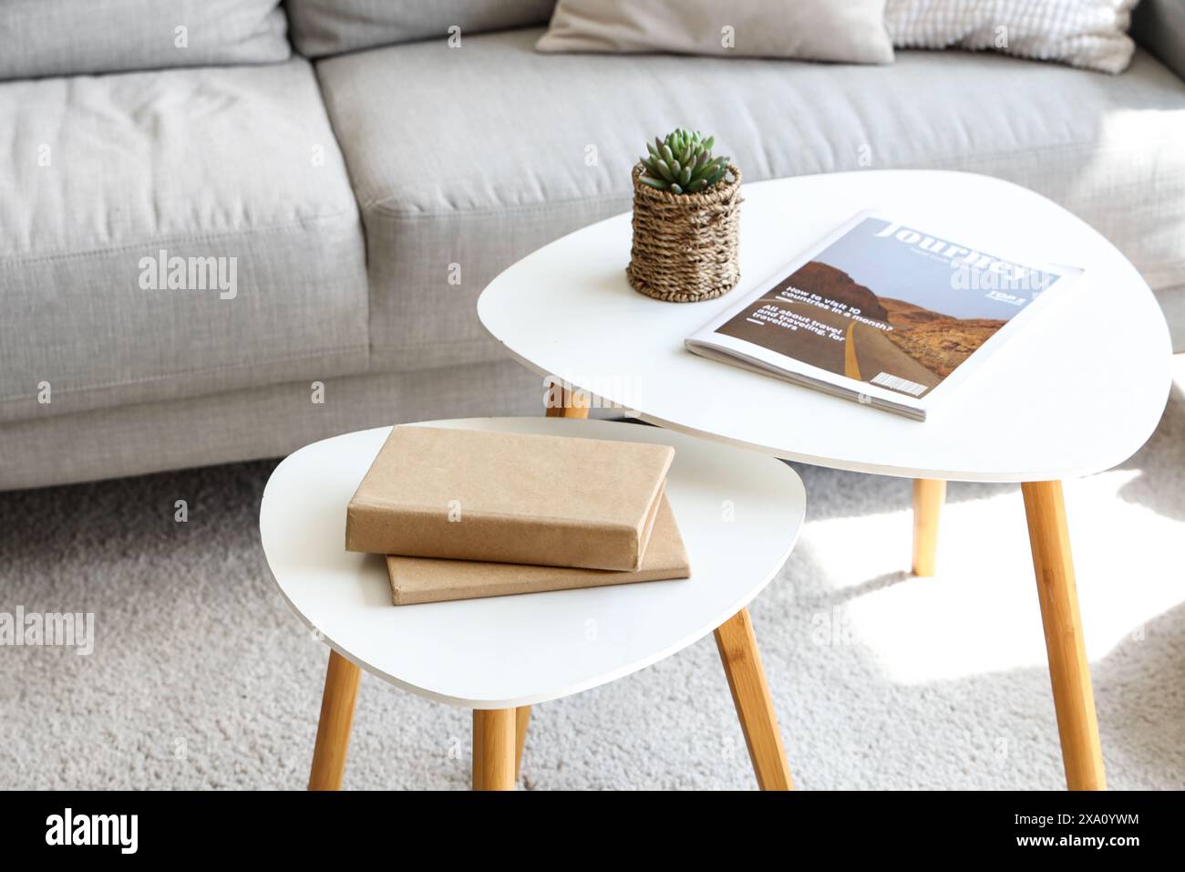 Books and magazine on coffee table in living room Stock Photo - Alamy