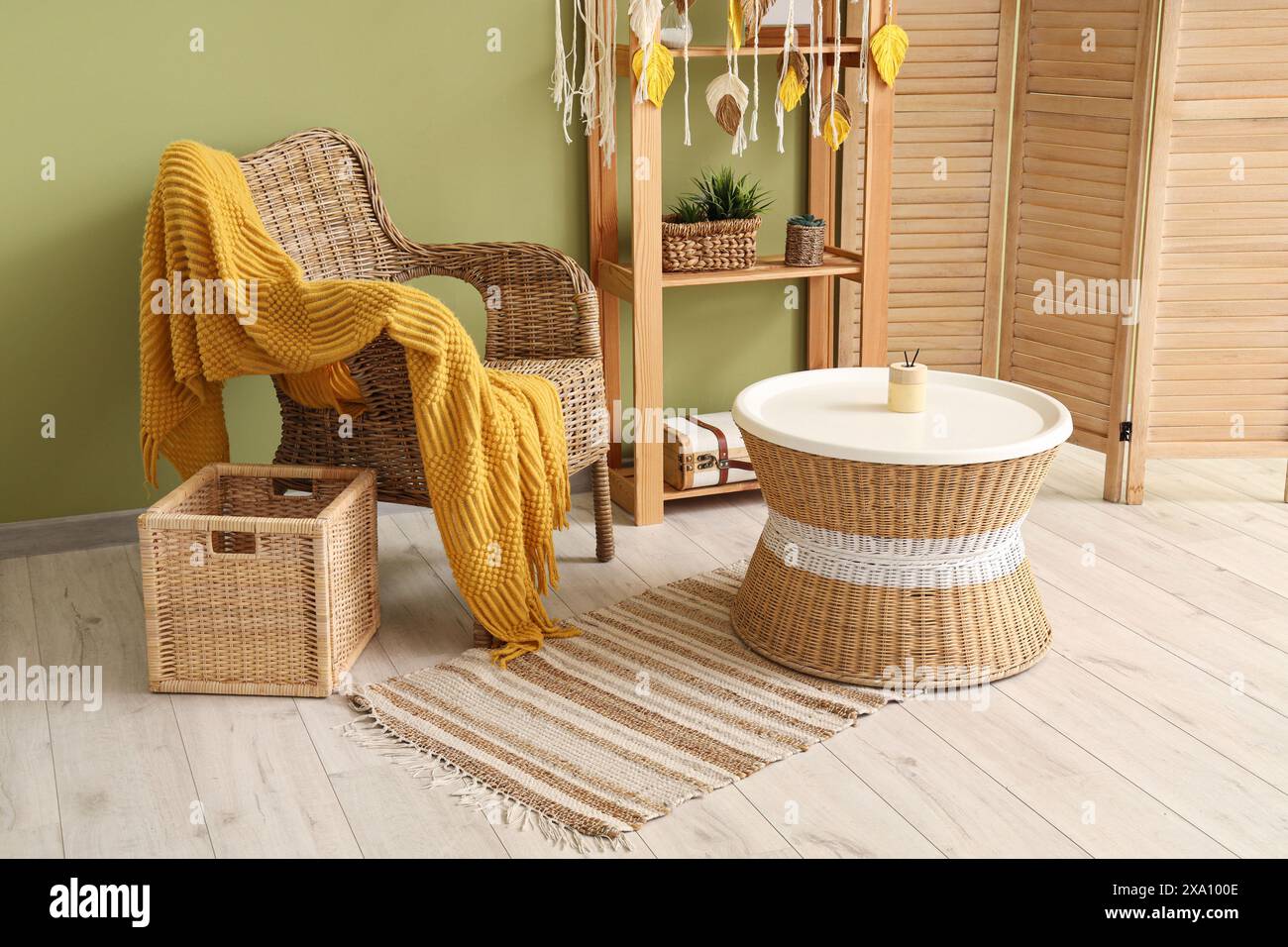 Interior of living room with cozy armchair with plaid, coffee table and ...