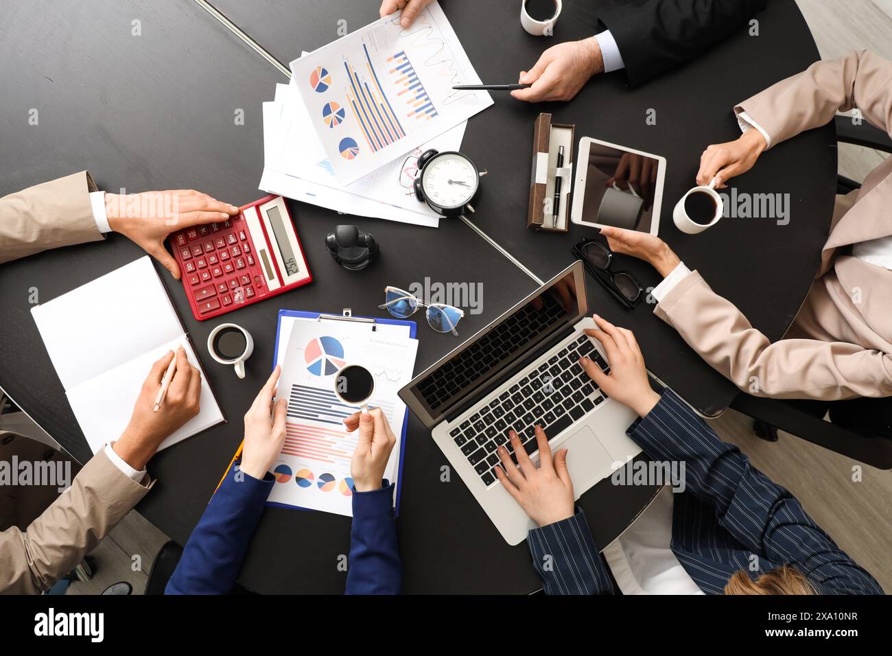Business people working with diagrams at black table, top view Stock ...