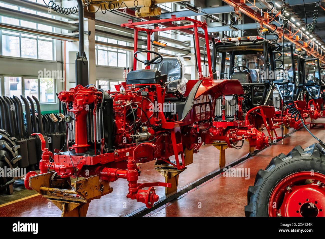 Tractor industry manufacture. New tractors on factory line. Production ...