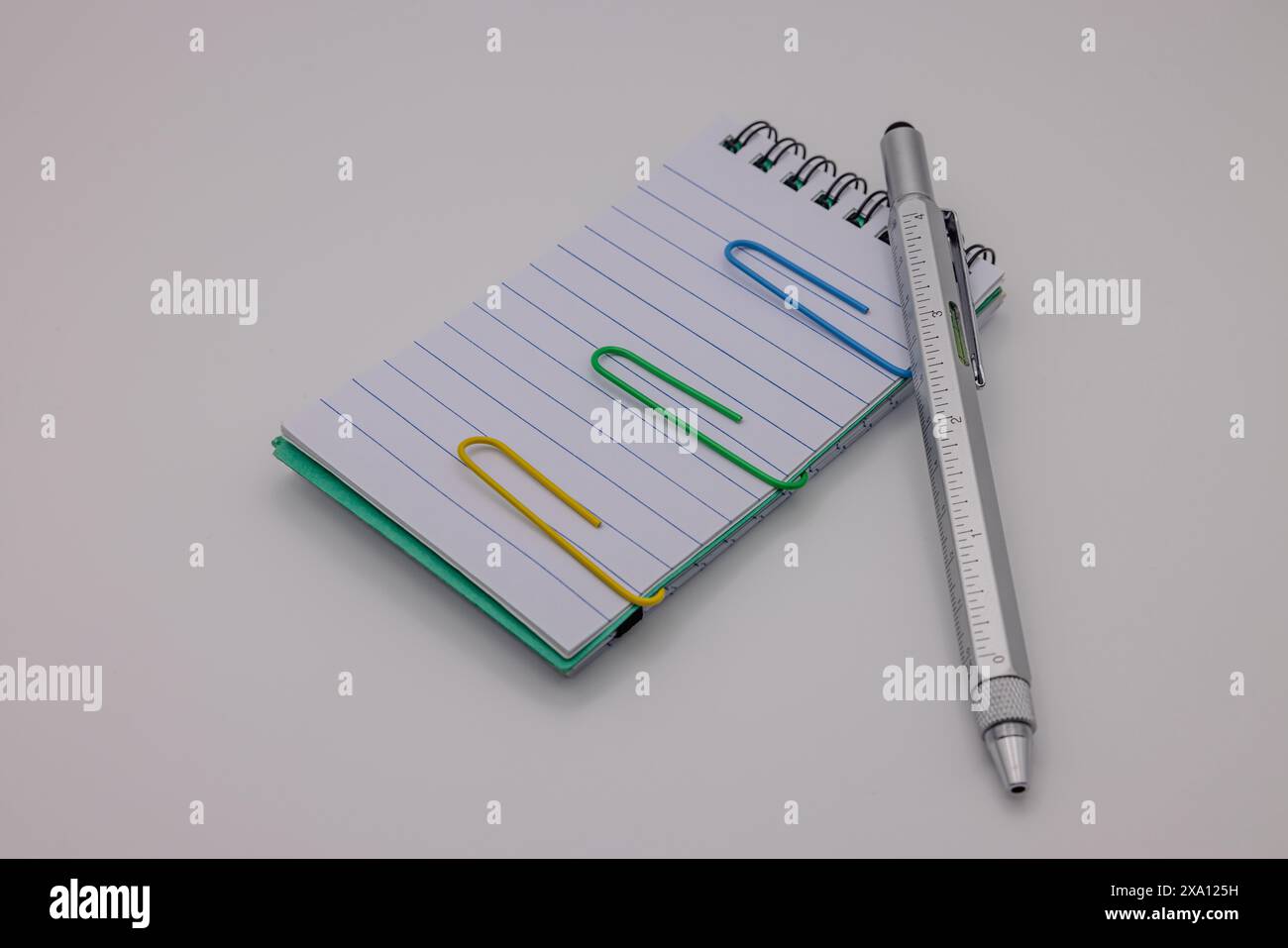 An open notebook with paper and a clipboard placed beside it Stock ...