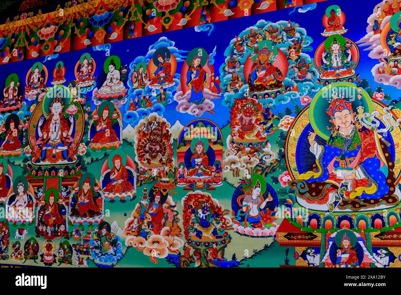 Buddhist temple interior featuring ornate decorations, statues of ...