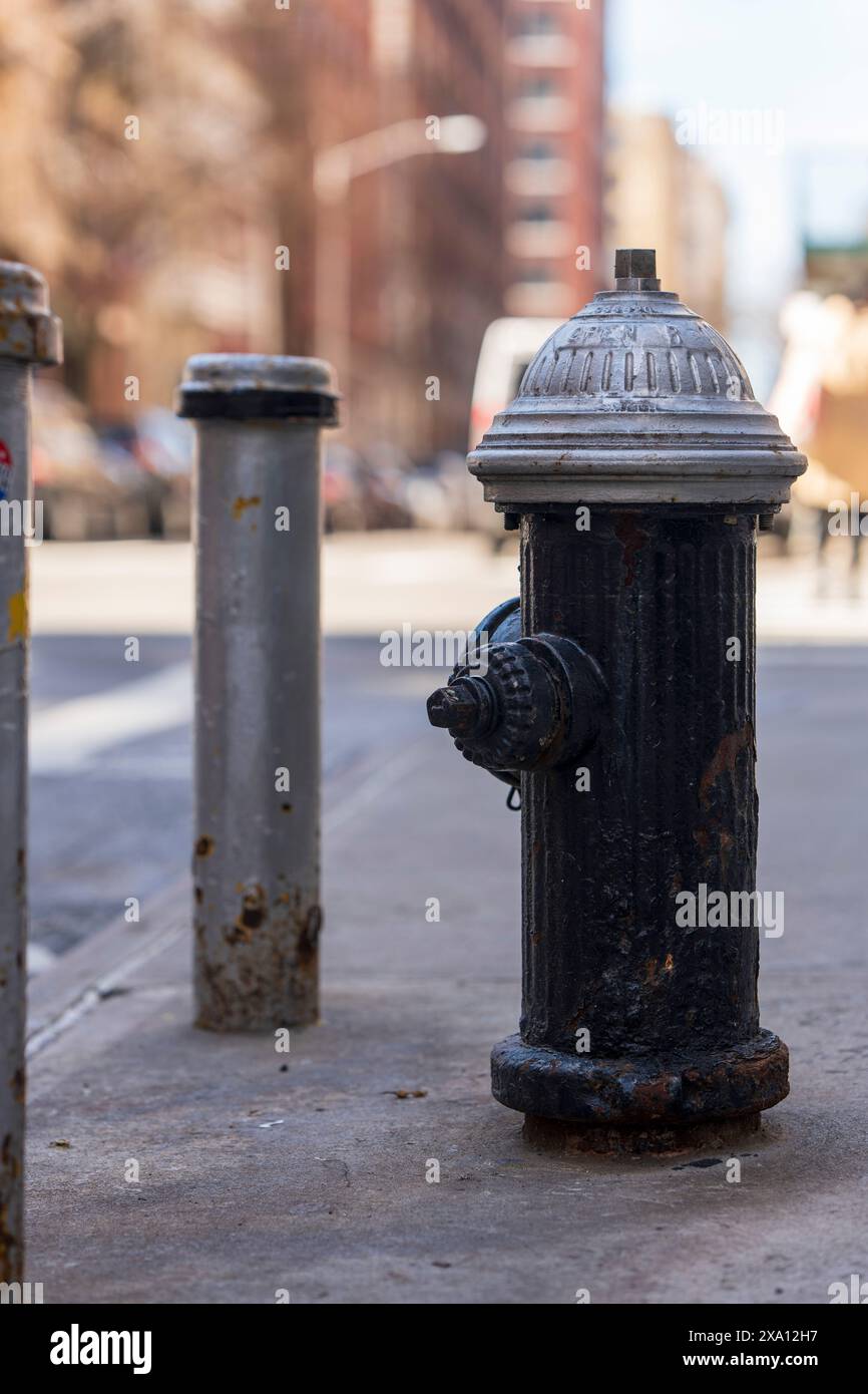 A black fire hydrant on the streets of New York City Stock Photo - Alamy