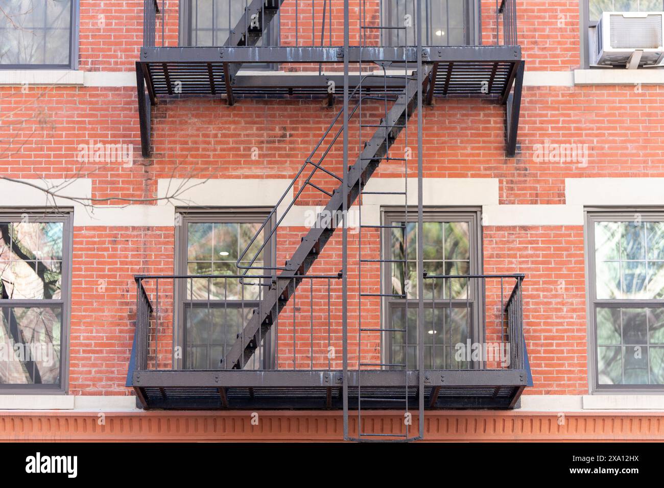 A brick building with fire exits in New York City Stock Photo - Alamy