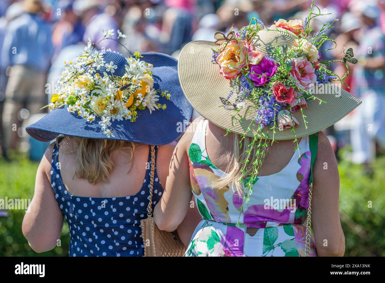 The two women in decorative floral derby hats at a social equestrian ...