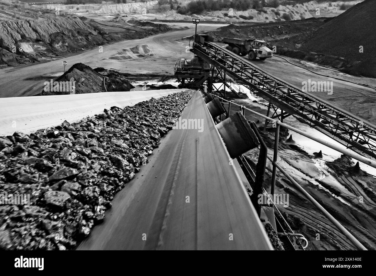 The coal loading at conveyor belt's top Stock Photo - Alamy