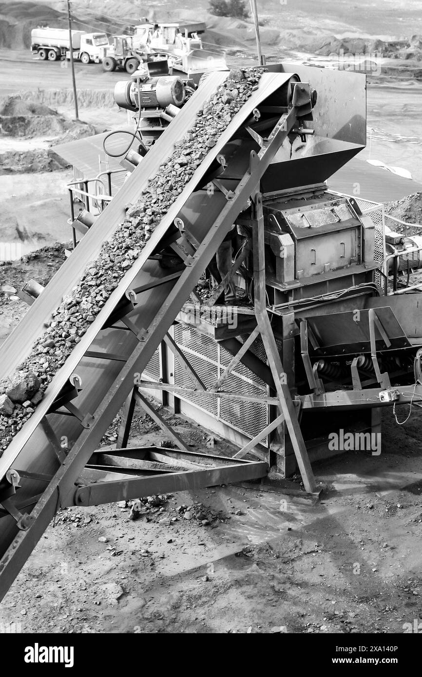 A loading platform in gravel area with trucks waiting Stock Photo - Alamy