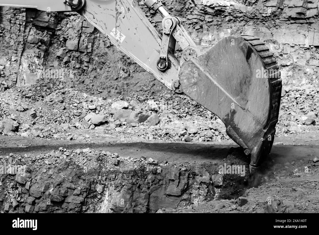 A construction worker operates a digger on a loader at a job site Stock ...