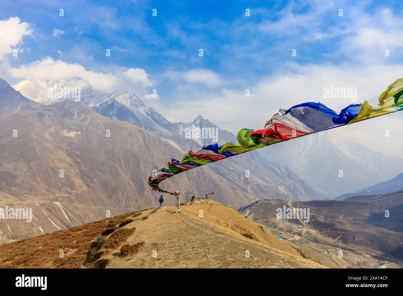 Colorful Nepali and Tibetan prayer flags fluttering in the majestic ...