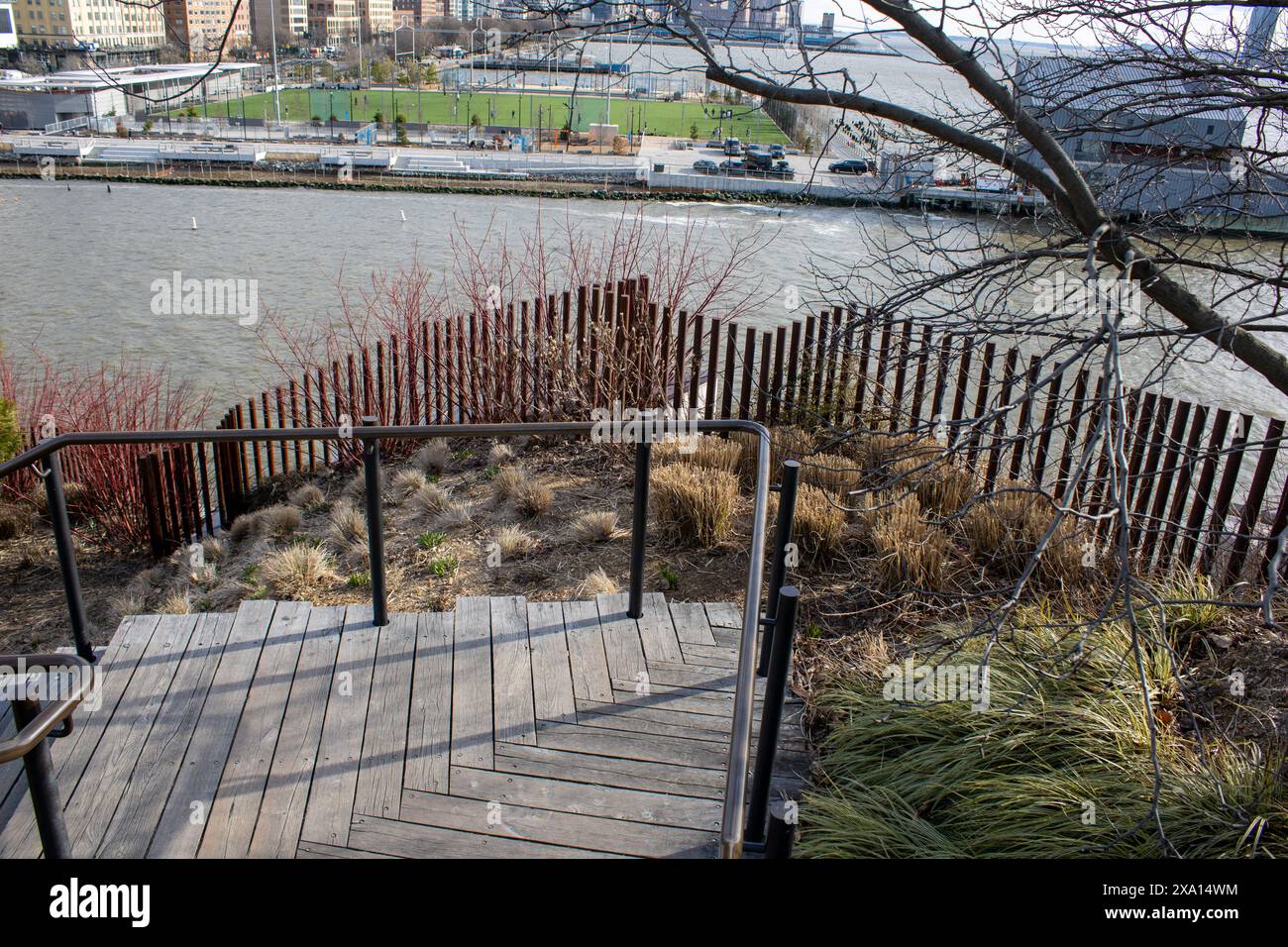 A scenic view of wooden walkway leading to bridge over river Stock ...